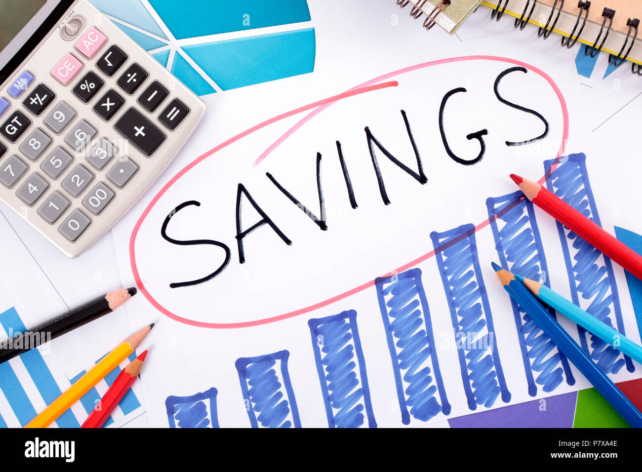 The word Savings written on a hand drawn bar chart surrounded by ...