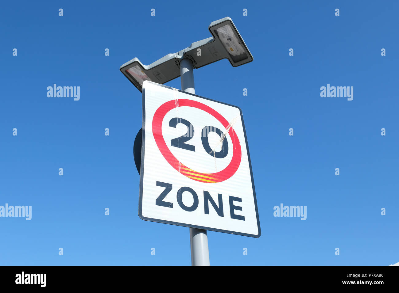 Twenty 20 mph road highway traffic safety sign against blue sky ...