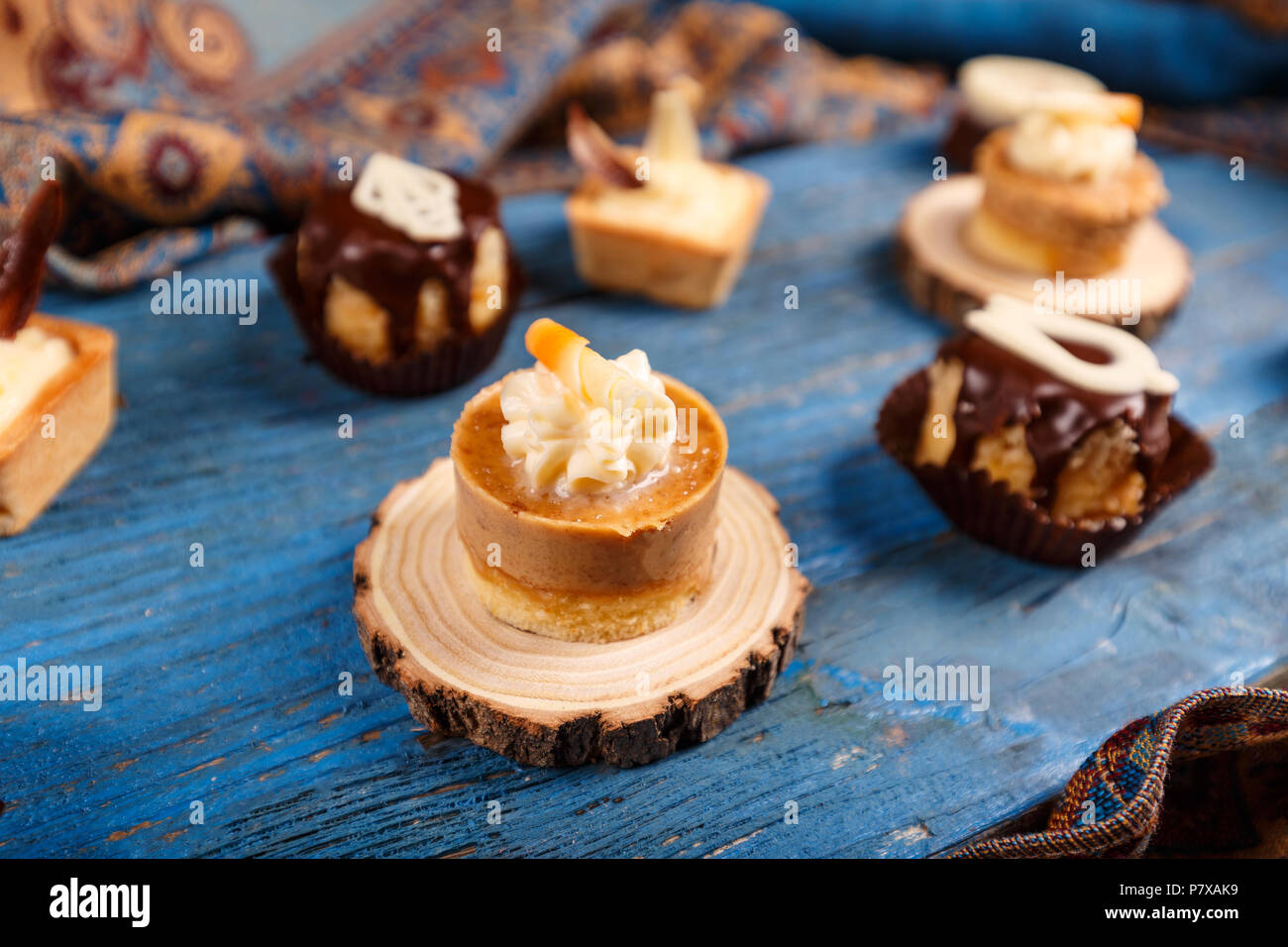 Mini cakes and tarts, small sweet dessert Stock Photo - Alamy