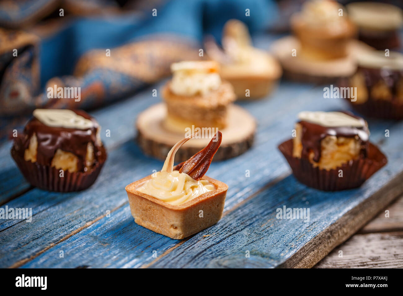 Mini cakes and tarts, small sweet dessert Stock Photo - Alamy