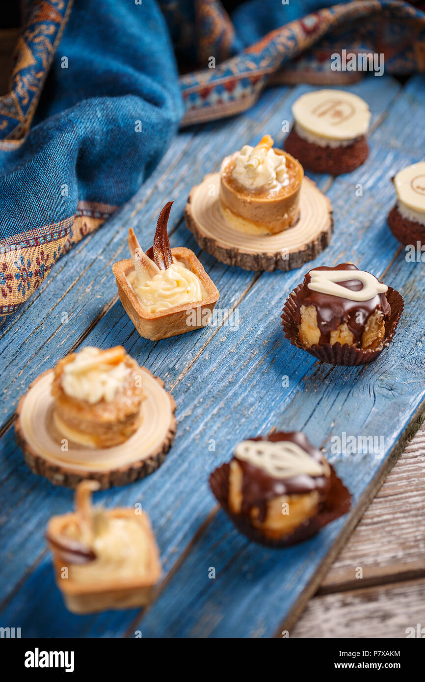 Different kinds of beautiful pastry, small sweet cakes Stock Photo - Alamy
