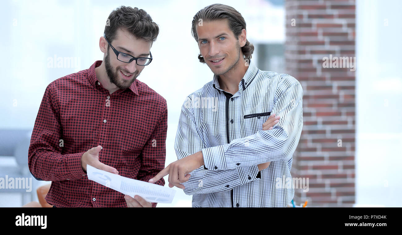 two office employee talking in the office Stock Photo - Alamy