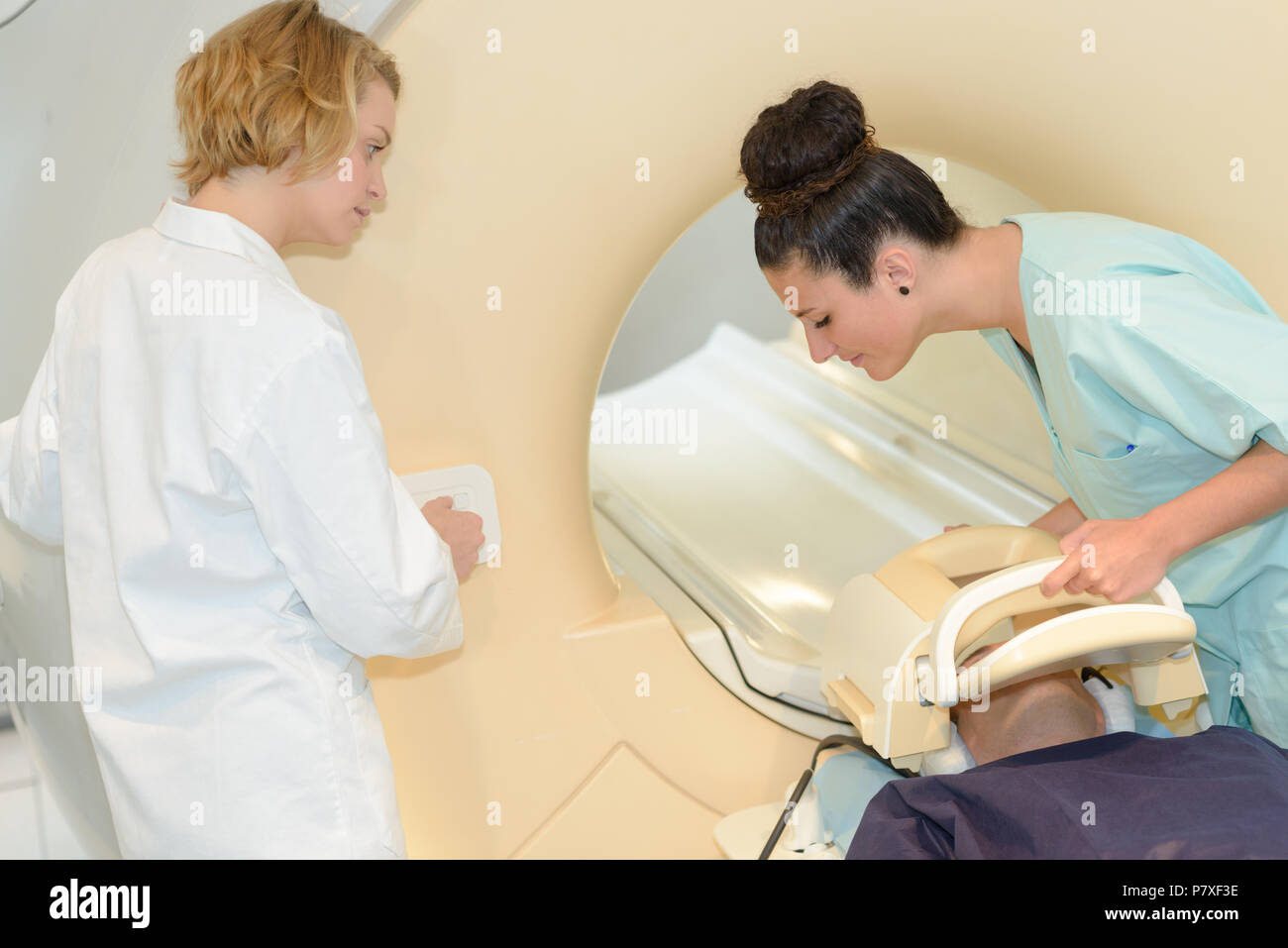 patient undergoing ct scan test in examination room Stock Photo - Alamy