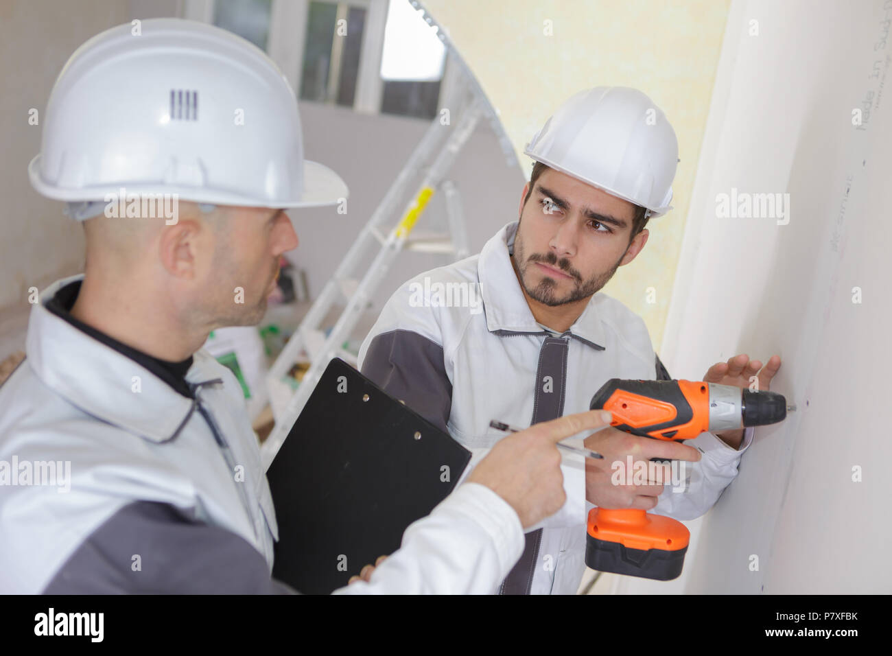 building inspector giving direction to the worker Stock Photo - Alamy