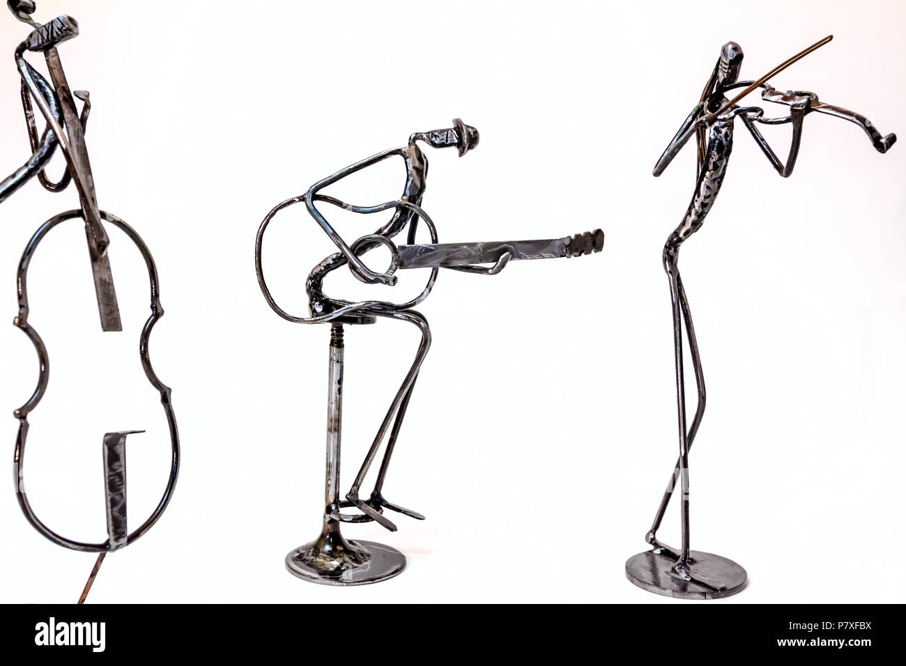 Figures of music performers made with welded black metal wire. Guitar ...