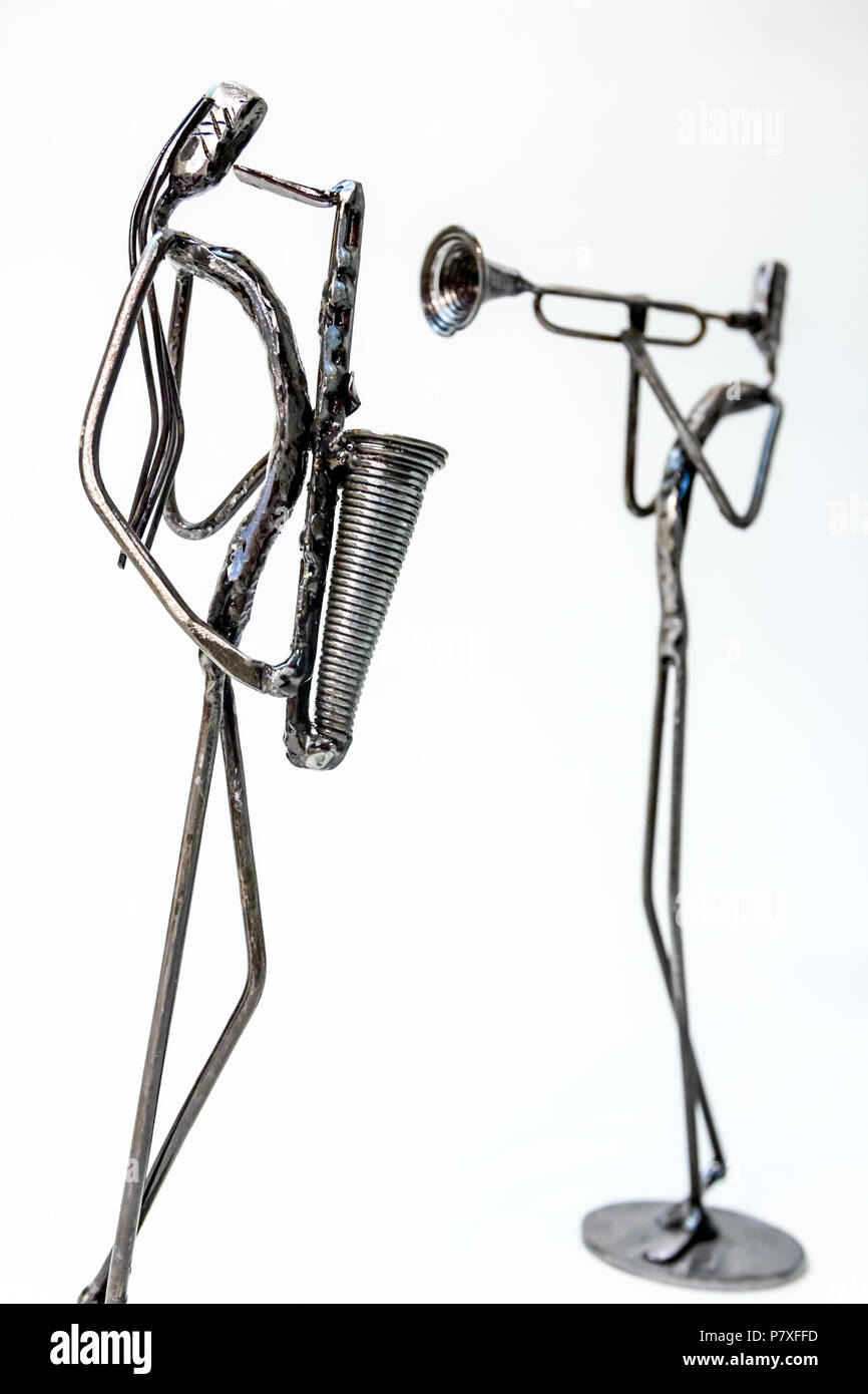 Figures of music performers made with welded black metal wire. Two ...