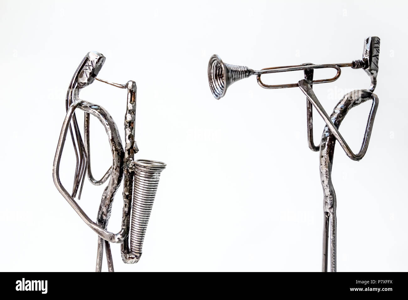 Figures of music performers made with welded black metal wire. Two ...