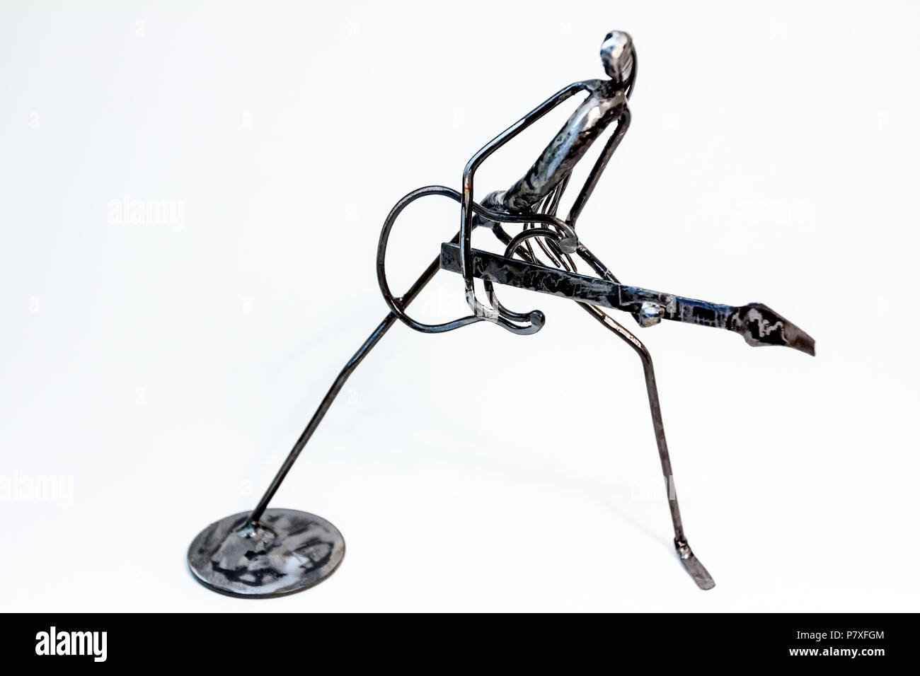 Figure of music performer made with welded black metal wire, guitarist ...