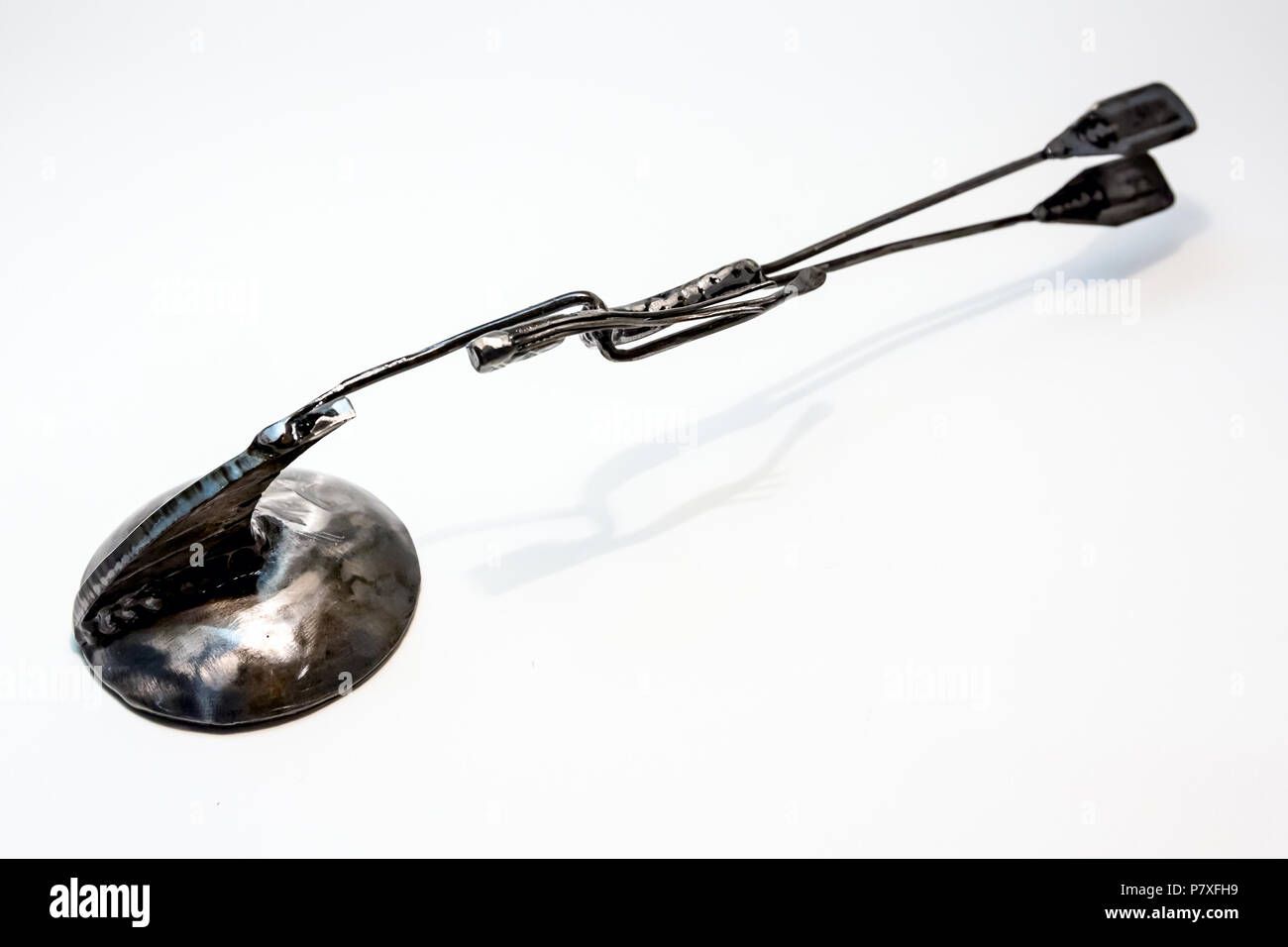 Paper holder as a figure made of welded black metal wire. Swimmer with ...