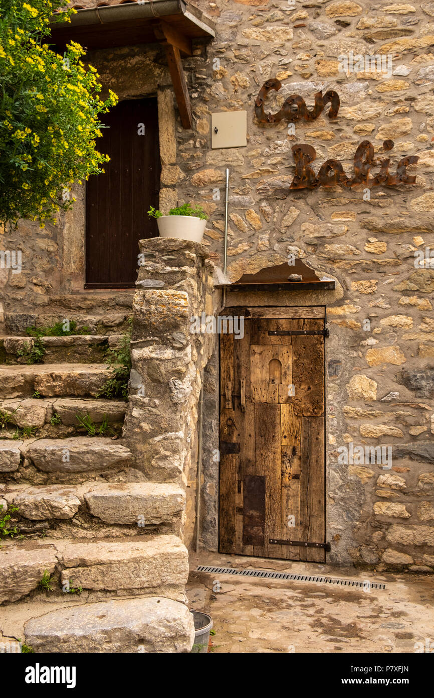Old wooden house door and stone steps in the winding backstreets of La ...