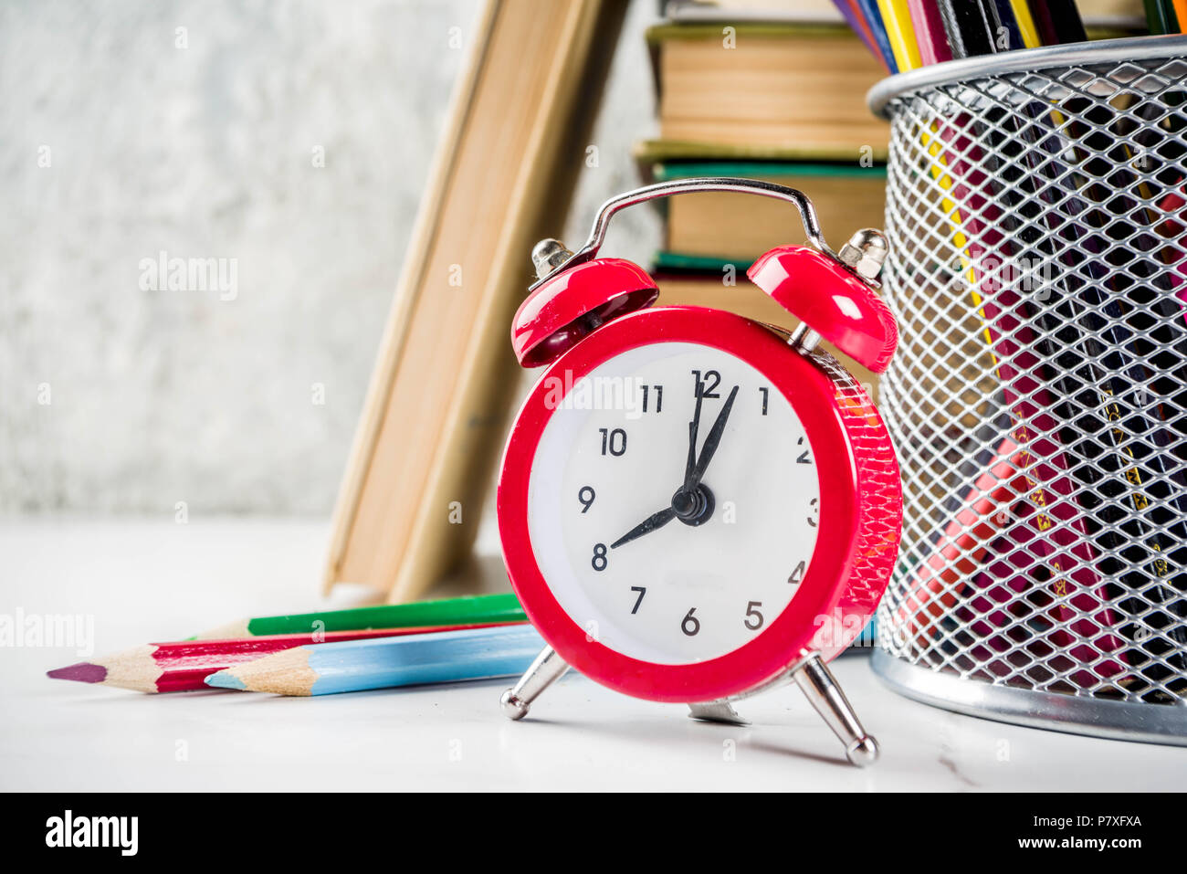 Back to school background with old books, alarm clock, pencils Stock ...