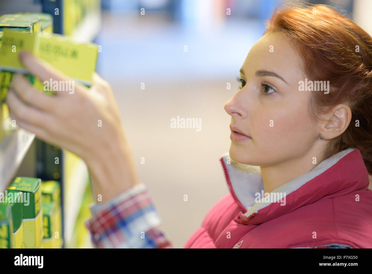 store shelf filler inspecting the product Stock Photo - Alamy