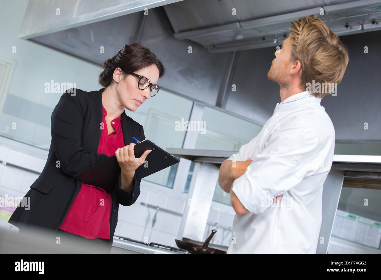 two male chefs working in kitchen Stock Photo - Alamy