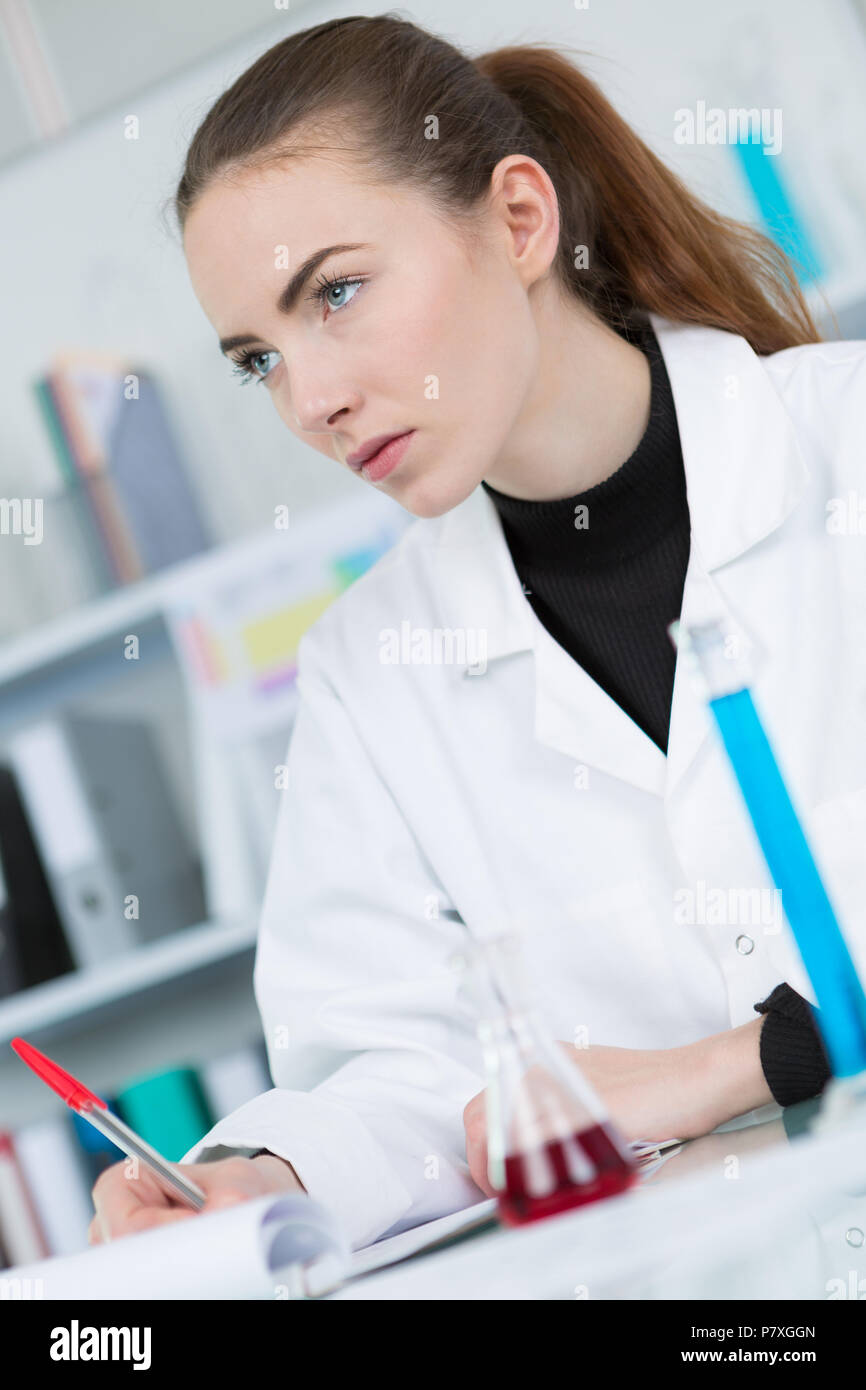 doctor taking notes during experiment Stock Photo - Alamy