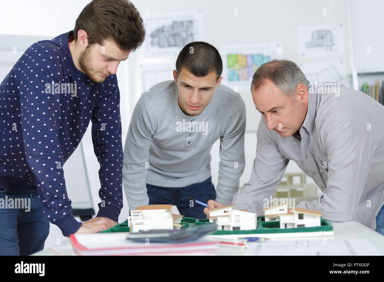 two students at their desk with building model Stock Photo - Alamy