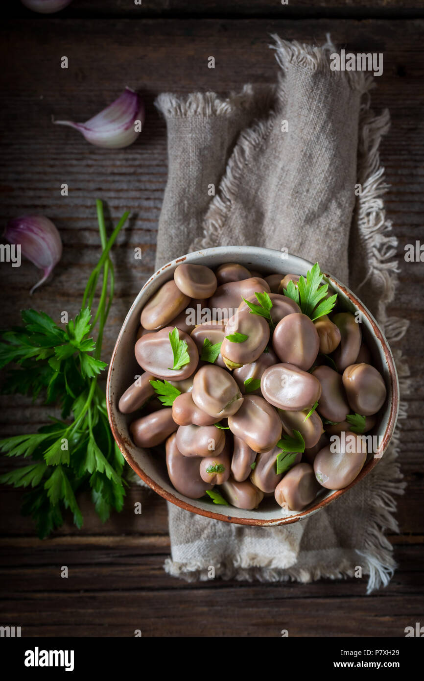 Broad beans boiled with fresh parsley and garlic Stock Photo - Alamy