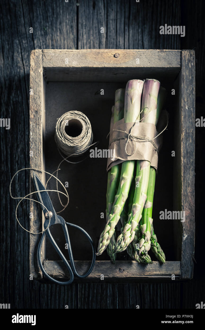 Green asparagus and string in a wooden box Stock Photo - Alamy