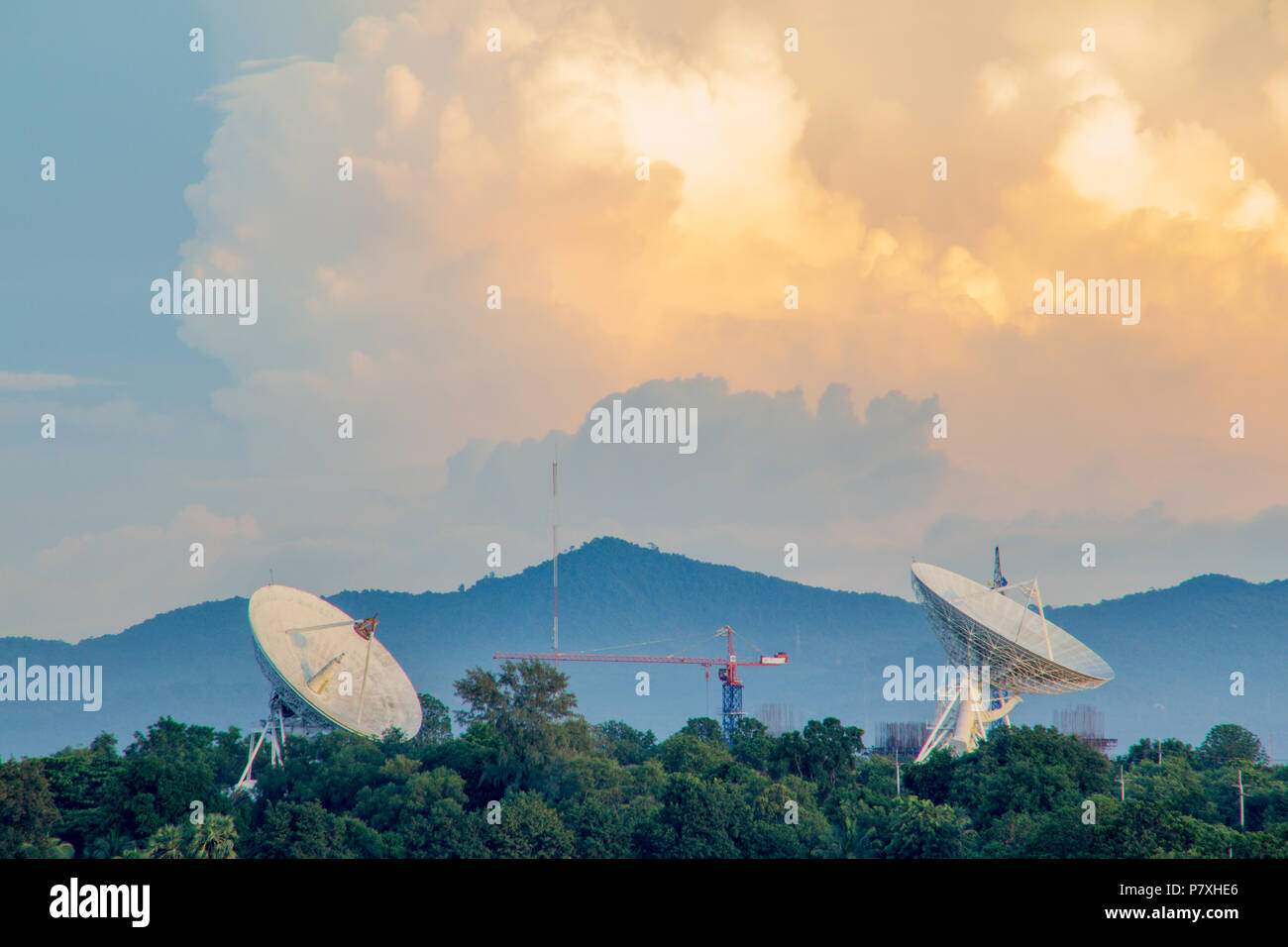 The gold sky with the gold cloud and two big satellite Stock Photo - Alamy