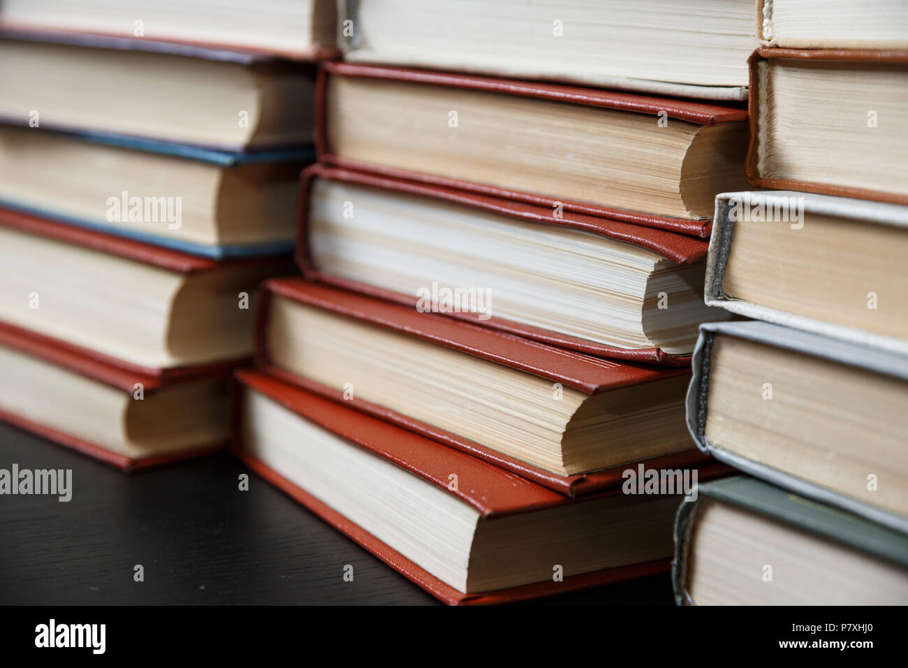 Stack of books background. many books Stock Photo - Alamy