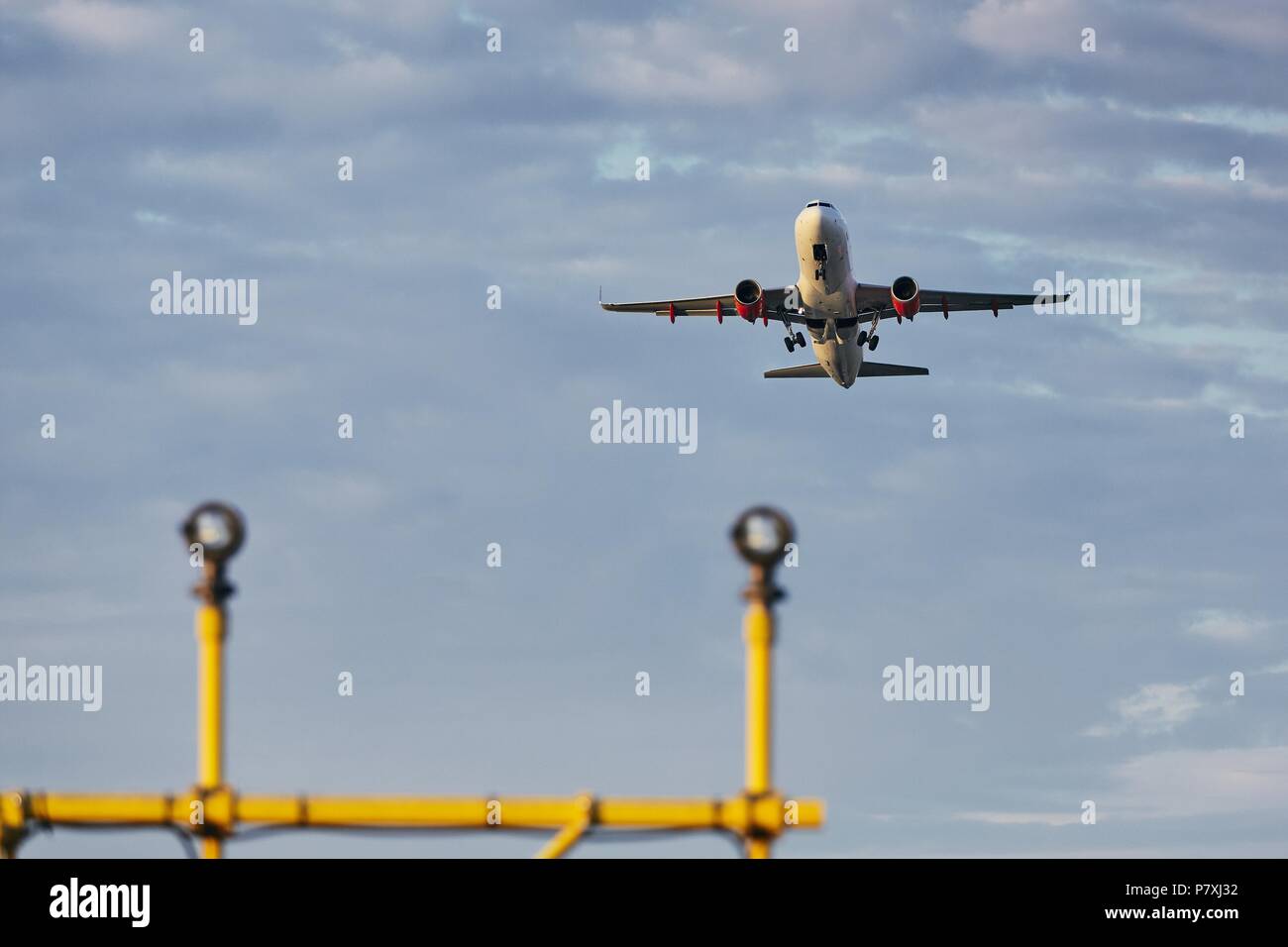 Traffic at the airport. Low angle view of the airplane during take off ...