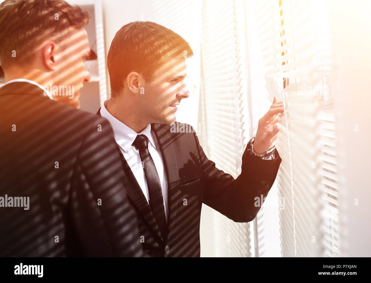business people look in the window office Stock Photo - Alamy