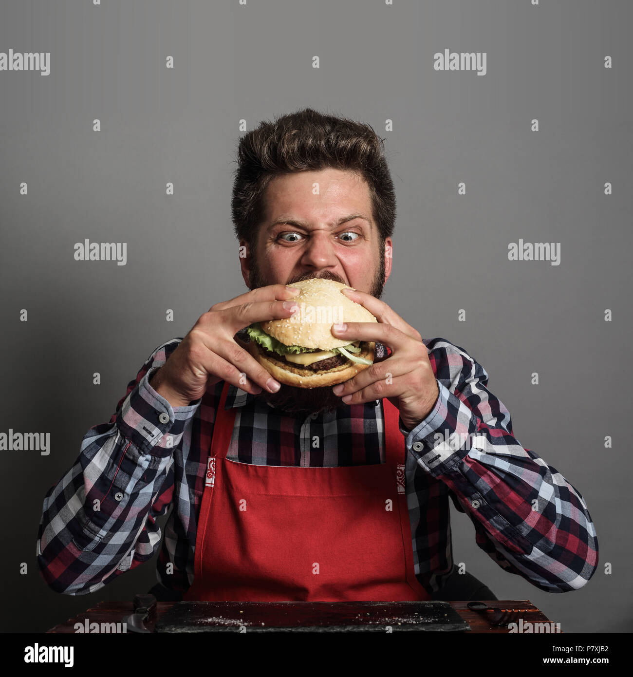 Funny man eating hamburger hi-res stock photography and images - Alamy