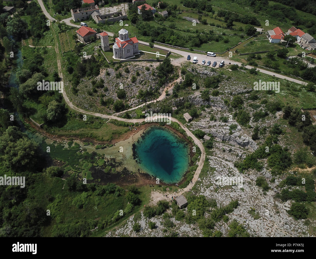 The spring of the Cetina River (izvor Cetine) in the foothills of the ...