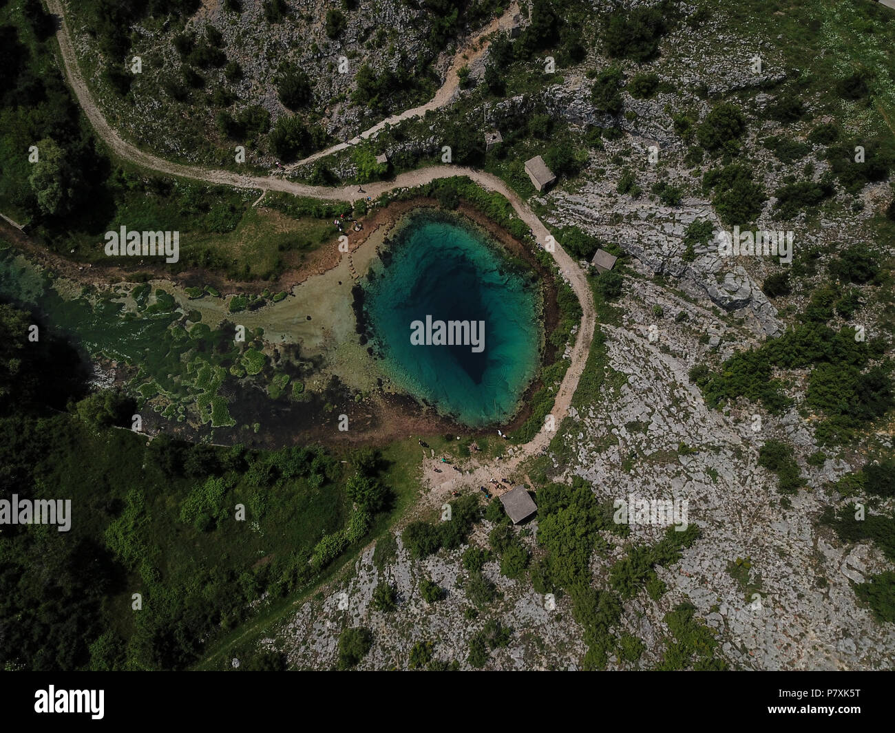 The spring of the Cetina River (izvor Cetine) in the foothills of the ...