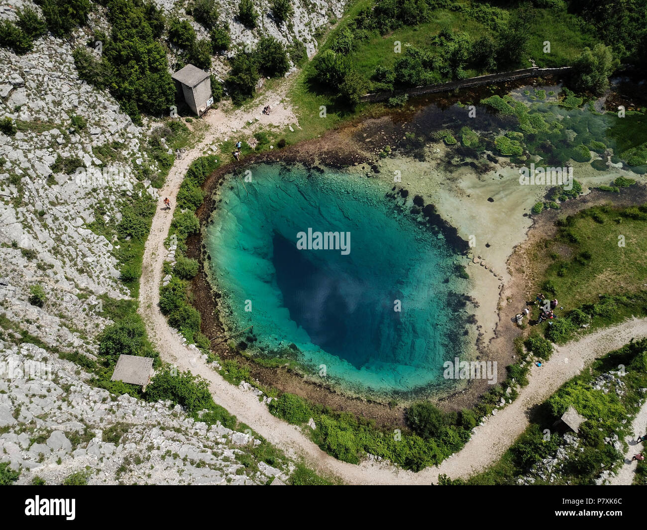 The spring of the Cetina River (izvor Cetine) in the foothills of the ...