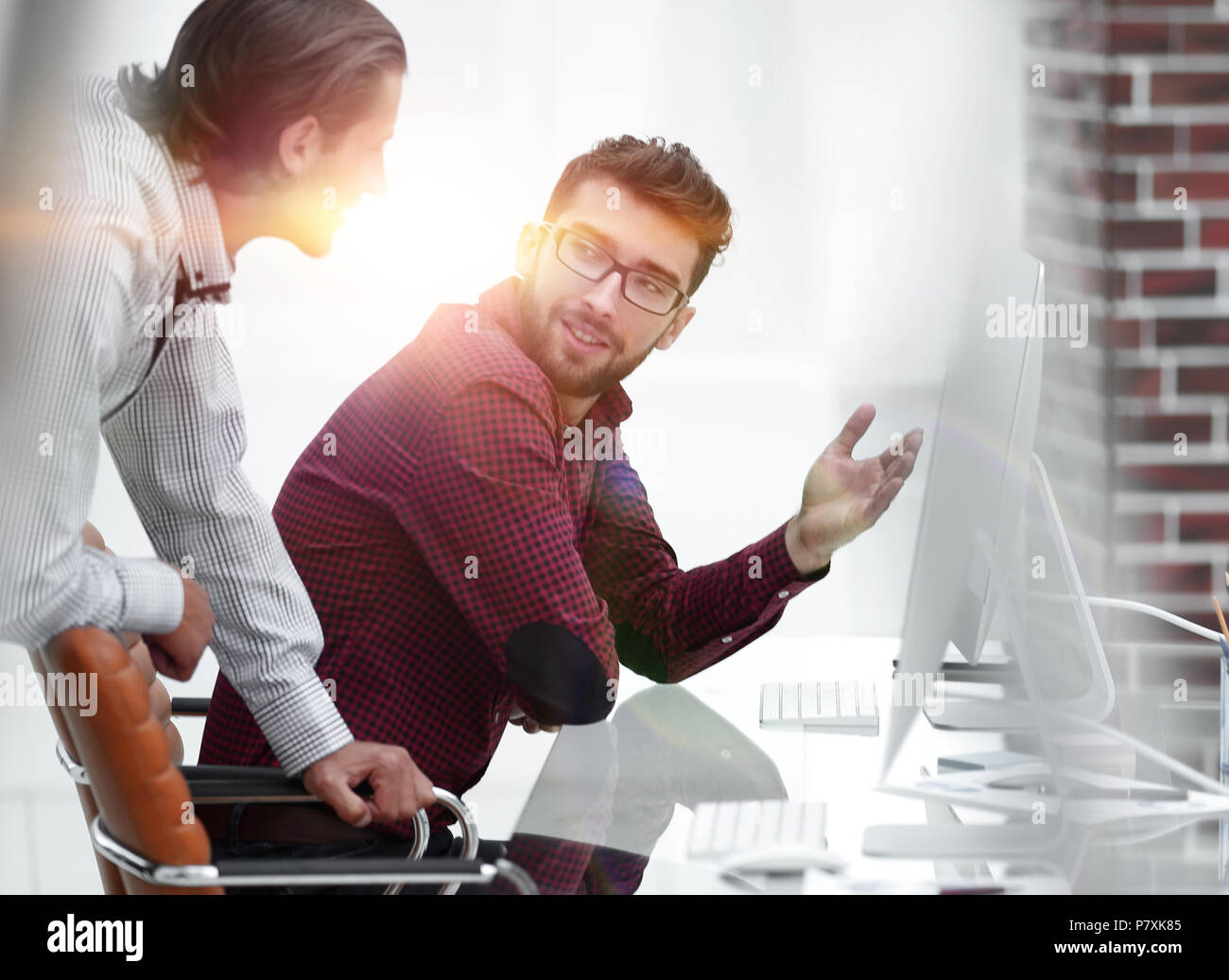 two office employee talking in the office Stock Photo - Alamy