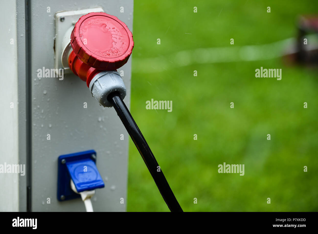 Raindrops are seen on industrial electric plug during heavy rain Stock ...