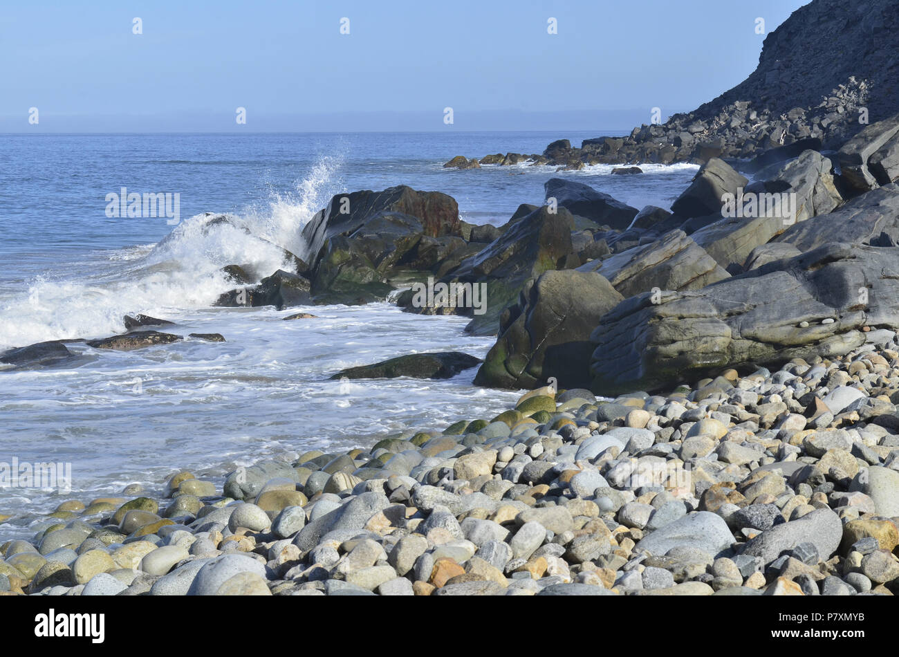 Pacific Ocean wave splashes against rock on coast Baja, Mexico Stock ...