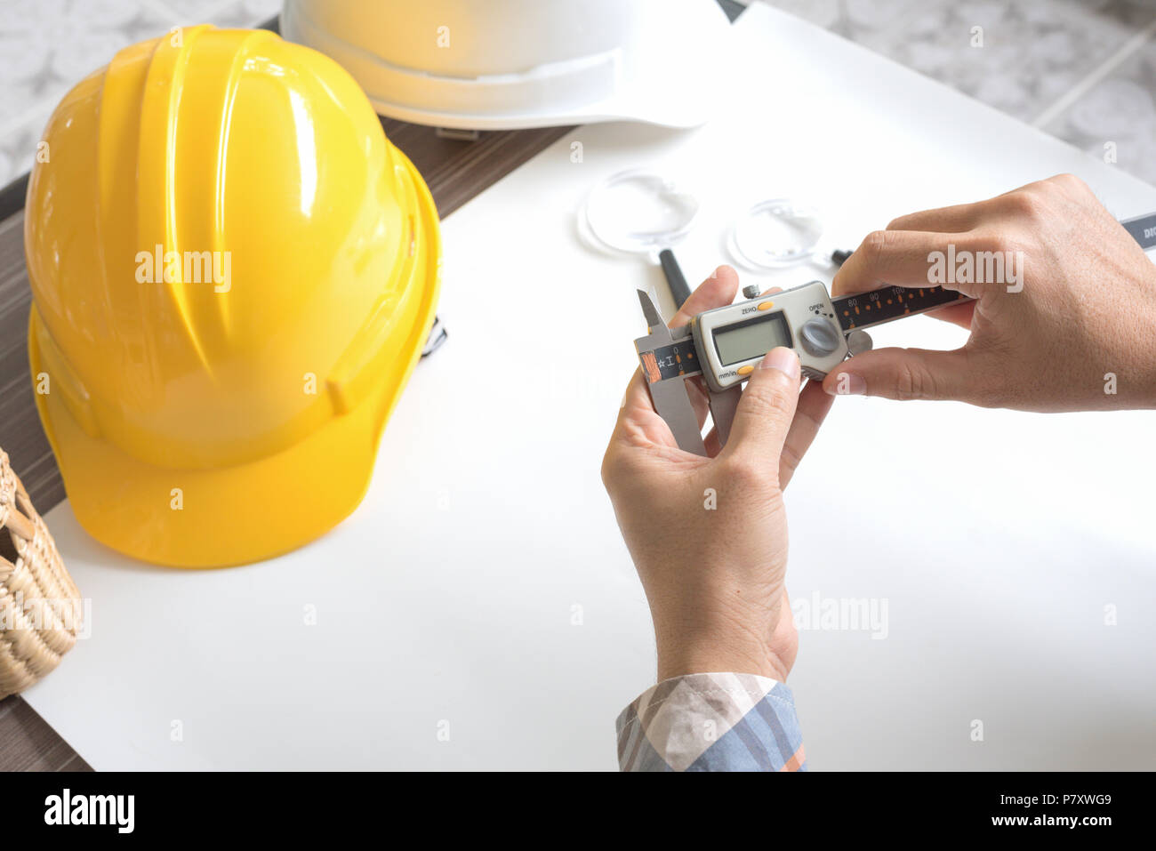 Construction engineer measuring with vernier caliper. Business and ...