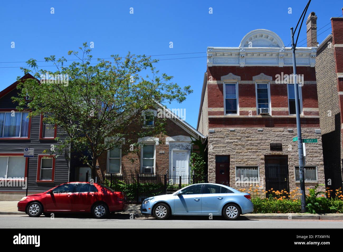 A small workers cottage on a residential street in Chicago's Pilsen ...