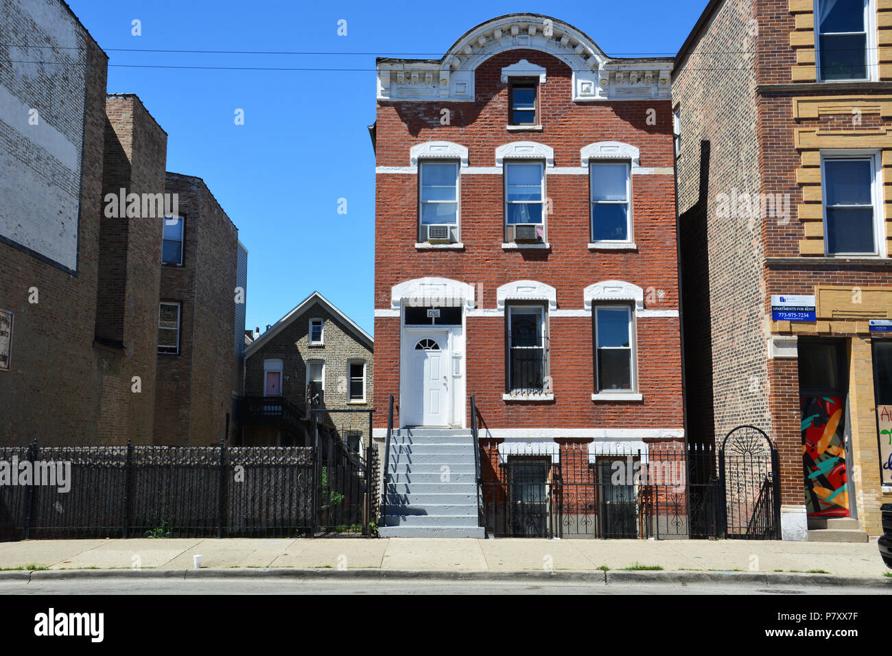A workers cottage faces the street with a coach house in the rear on ...