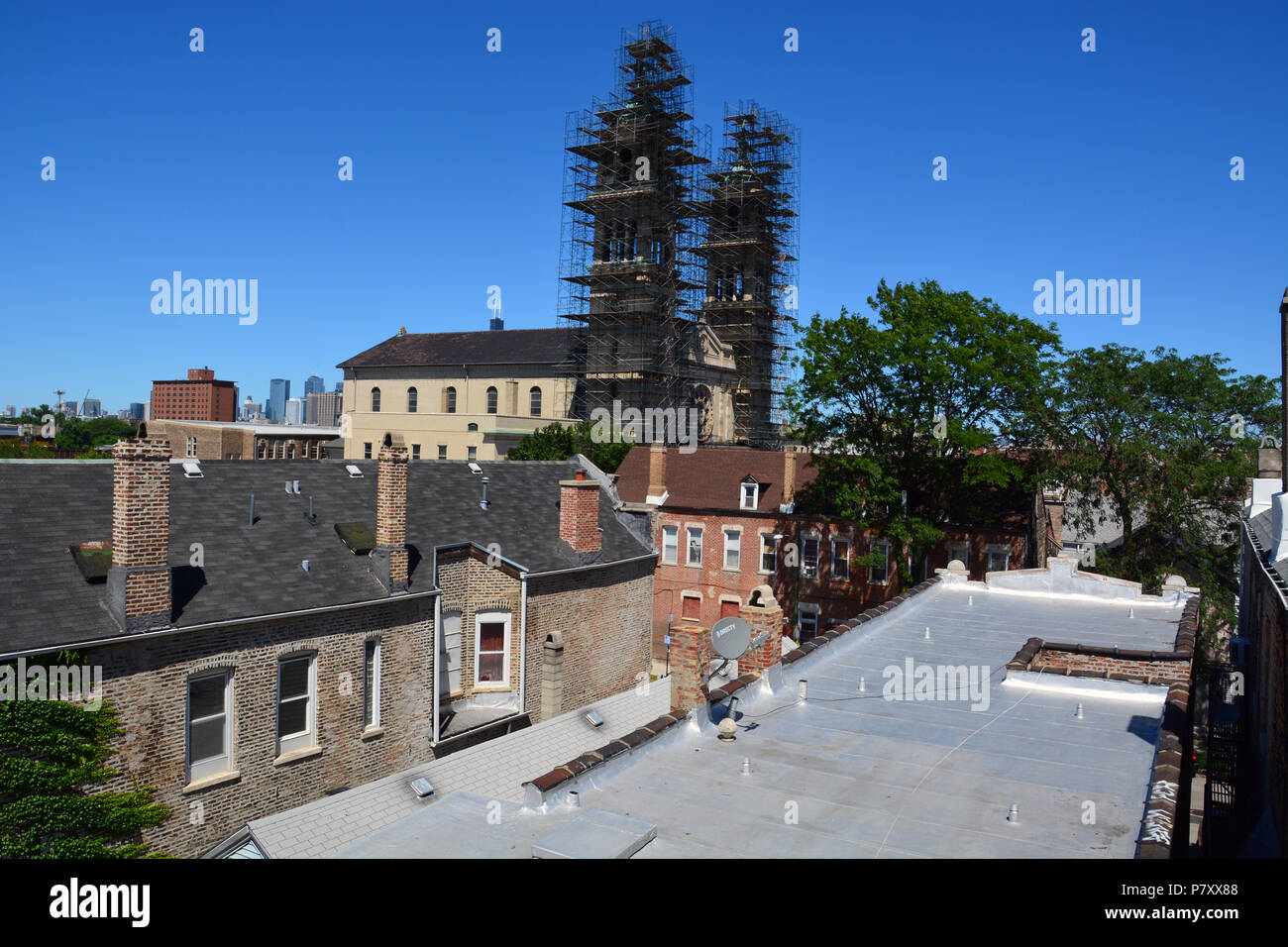 The twin bell towers of St Adalbert's Church wrapped in protective ...