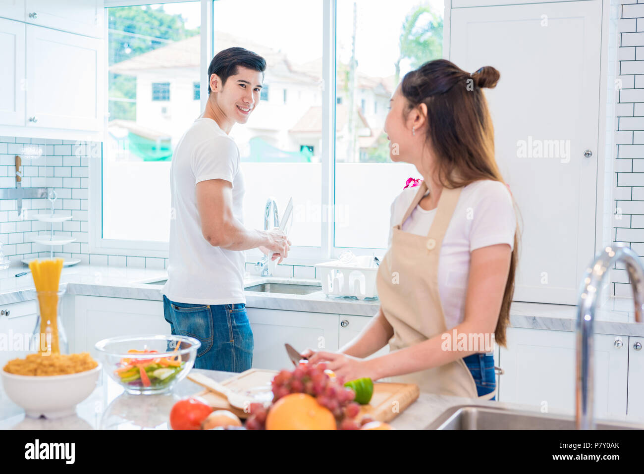 Lovers cooking together in kitchen hi-res stock photography and images ...