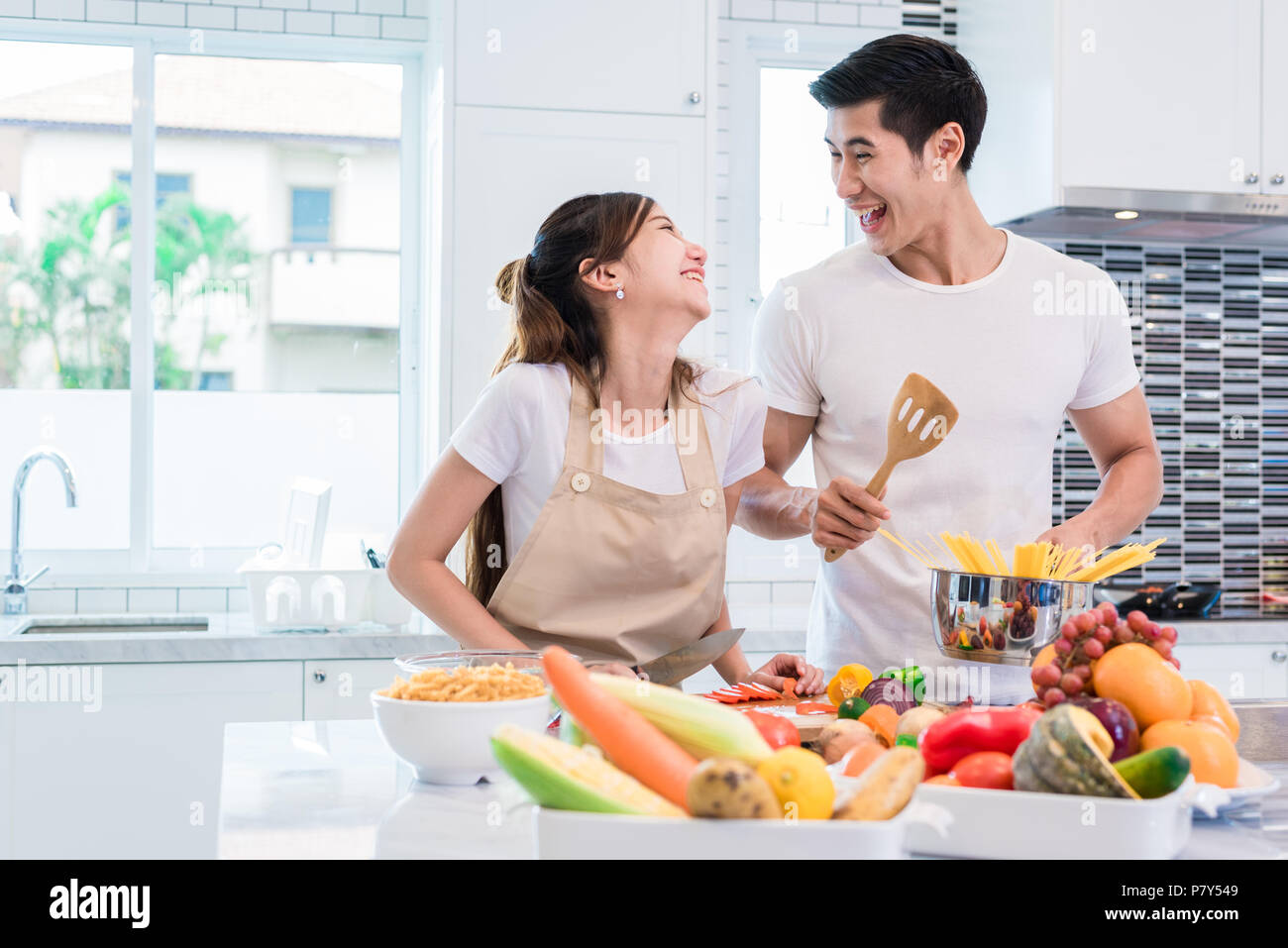 Lovers cooking together in kitchen hi-res stock photography and images ...