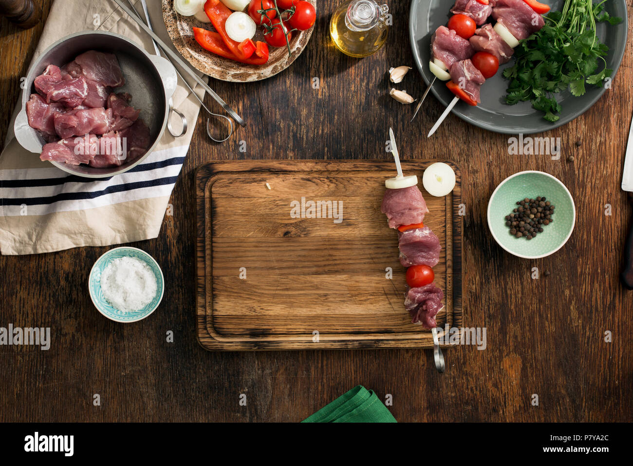 Raw shish kebab on a rustic wooden table, top view Stock Photo - Alamy