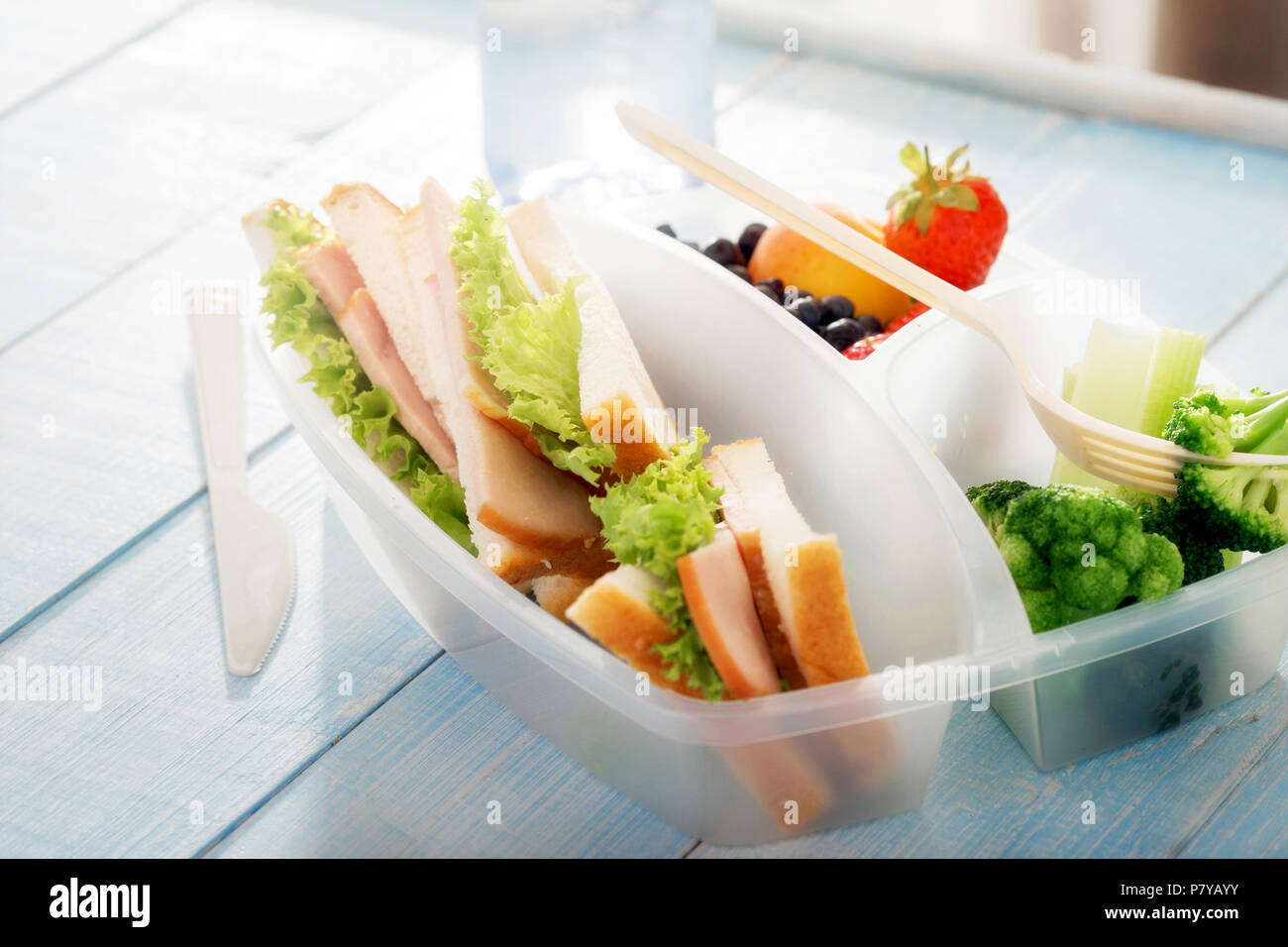 Full lunch box of healthy food on wooden table close up. Healthy lunch ...