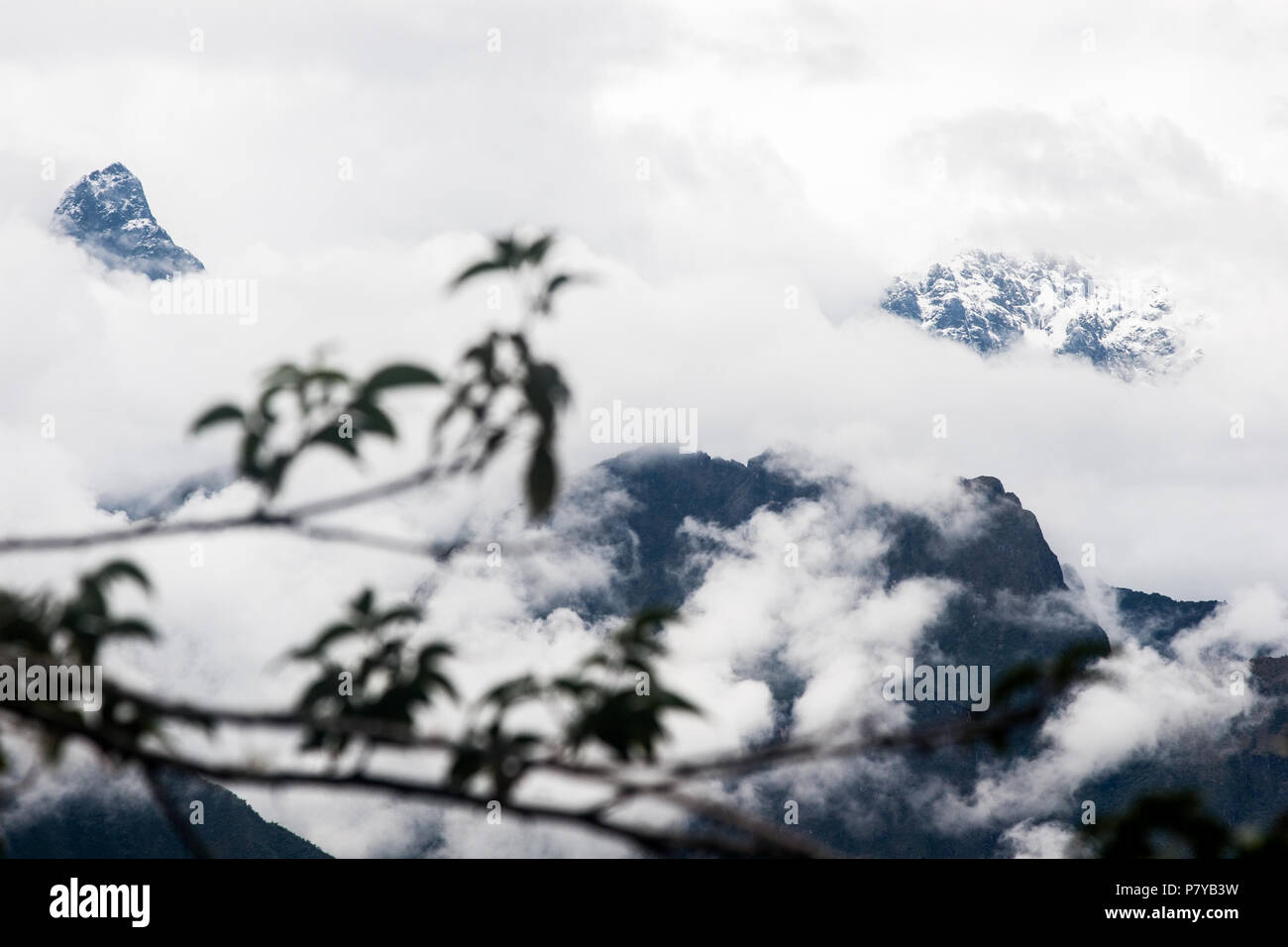 Intense fog and clouds covering the peak of a mountain on the Andes ...