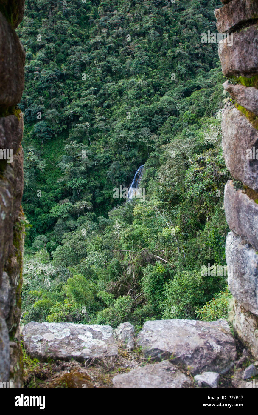 Ancient stone window view of the mountains with a waterfall Stock Photo ...