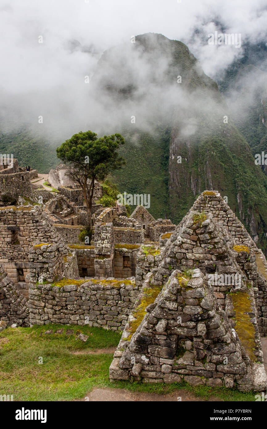 Ancient homes with muntains in mist Stock Photo - Alamy