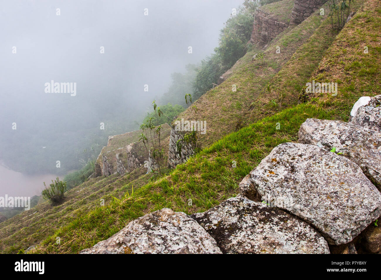 Inca architecture on a cliff Stock Photo - Alamy