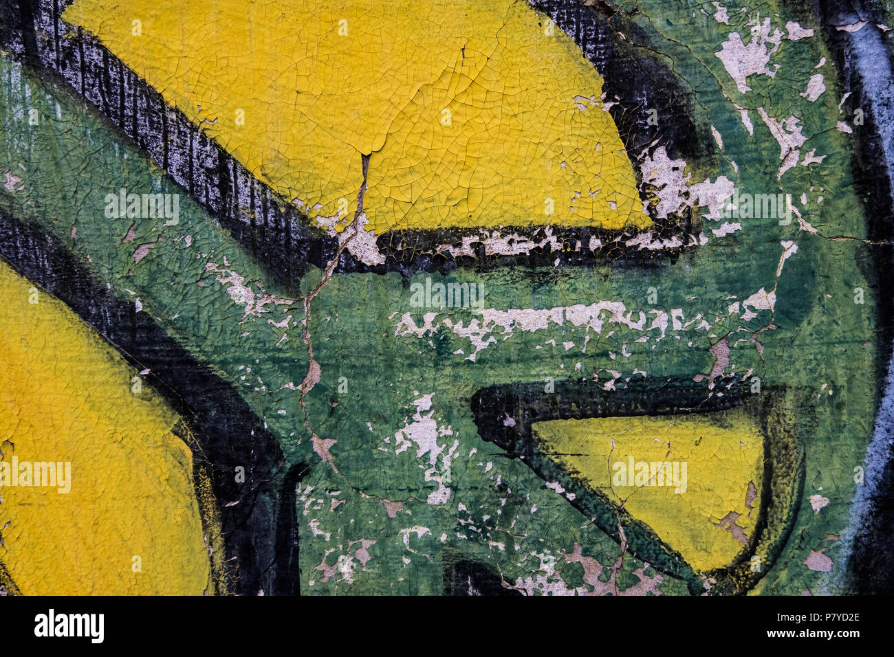 Peace yellow and green graffiti on cracked wall Stock Photo - Alamy