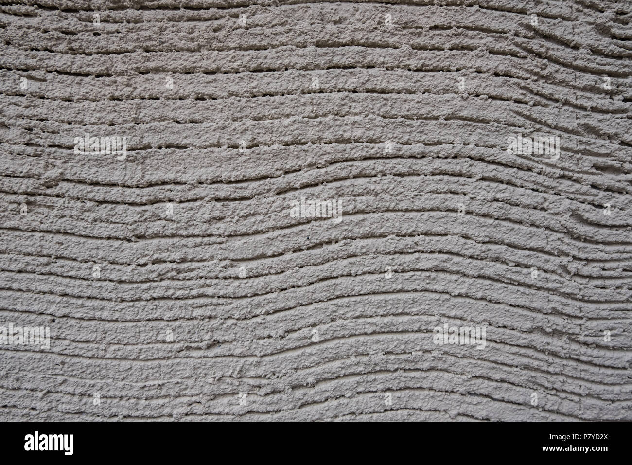 Rough wave texturized grey wall Stock Photo - Alamy
