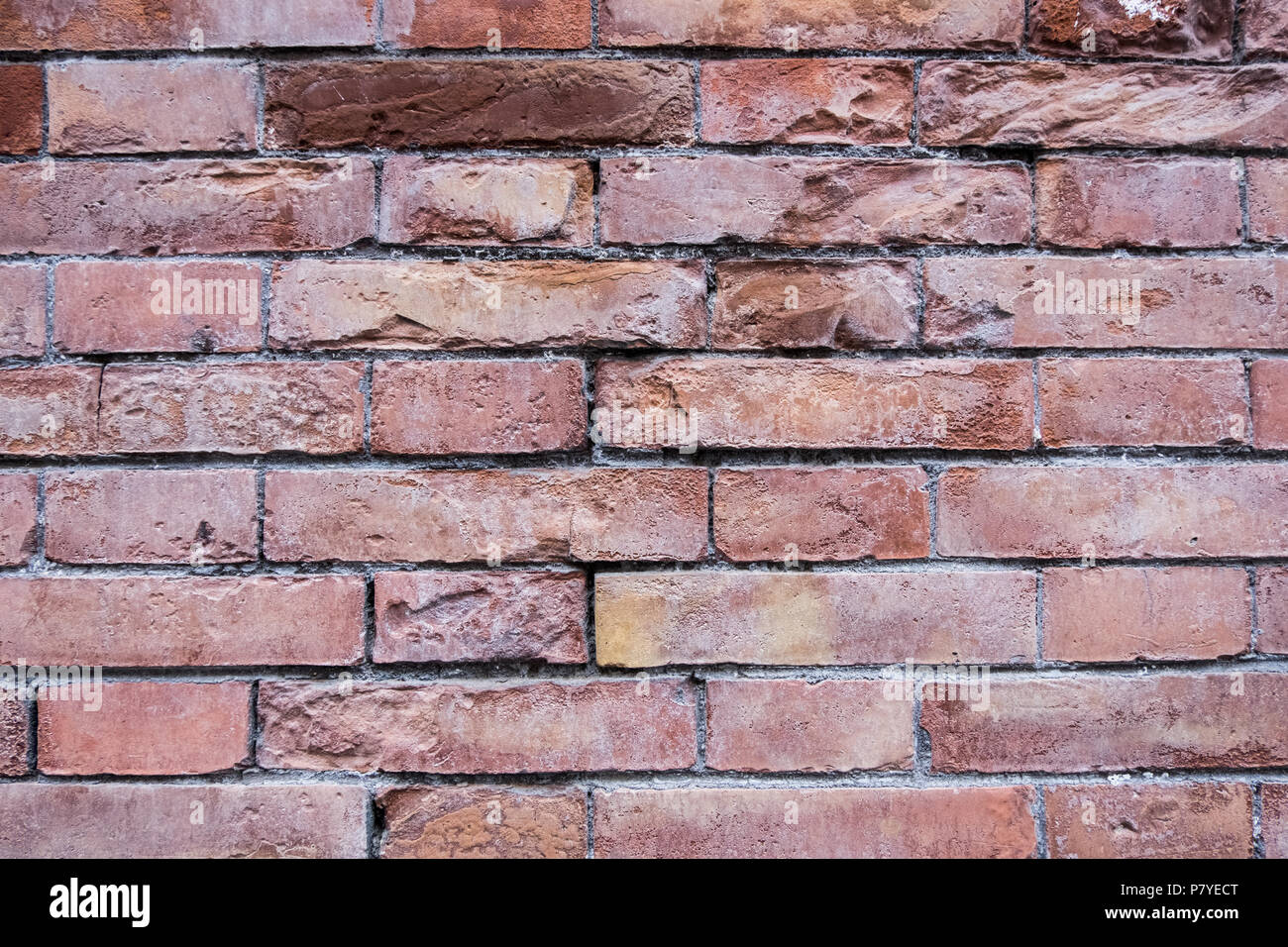 Red brick wall with scratches texture Stock Photo - Alamy