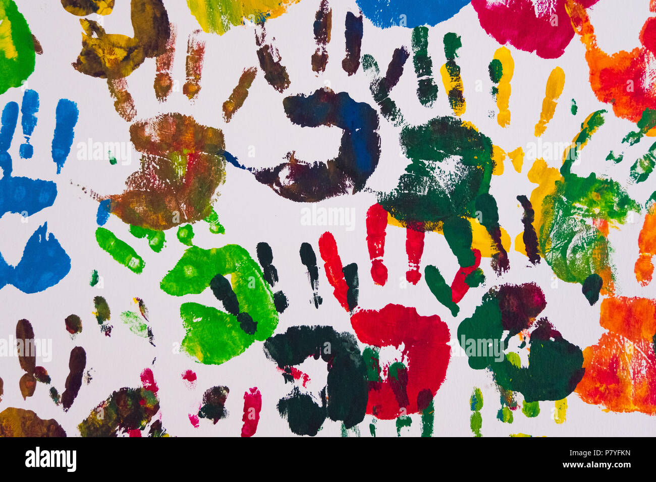 Detail of colorful handprints on a wall Stock Photo - Alamy