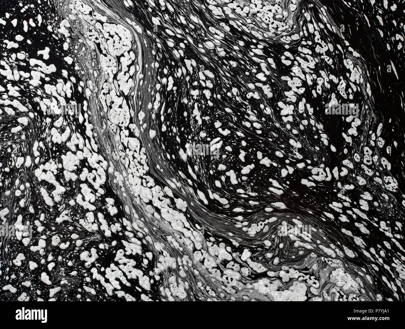 abstract patterns of foam floating on water Stock Photo - Alamy