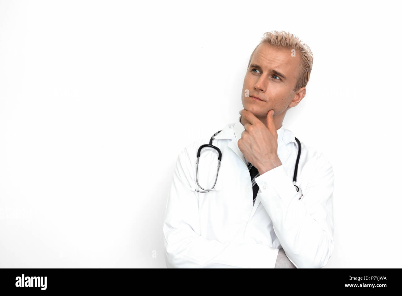Doctor with stethoscope thinking and imagine on the white background ...